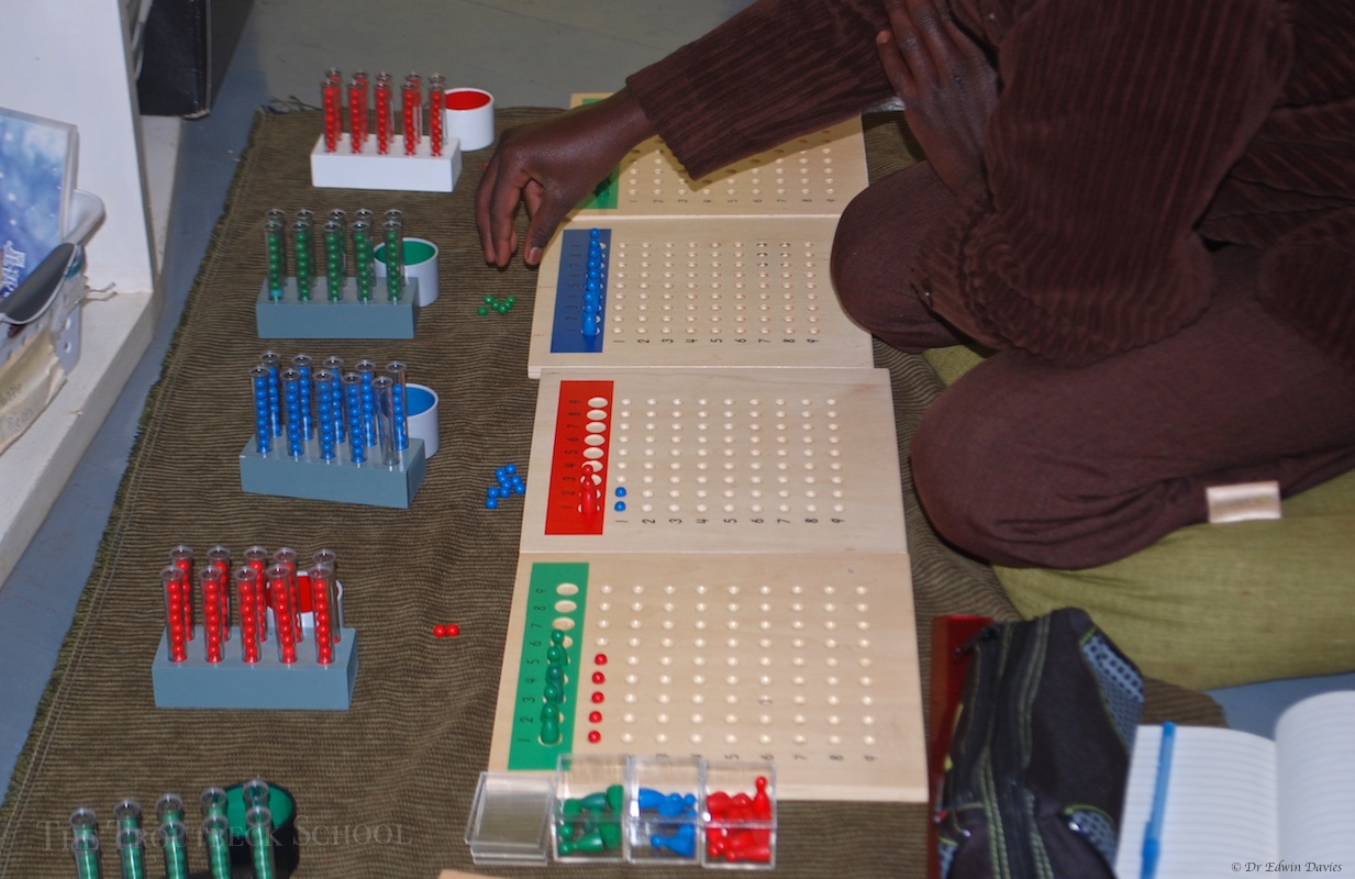 Long division using the Montessori long division material | The ...